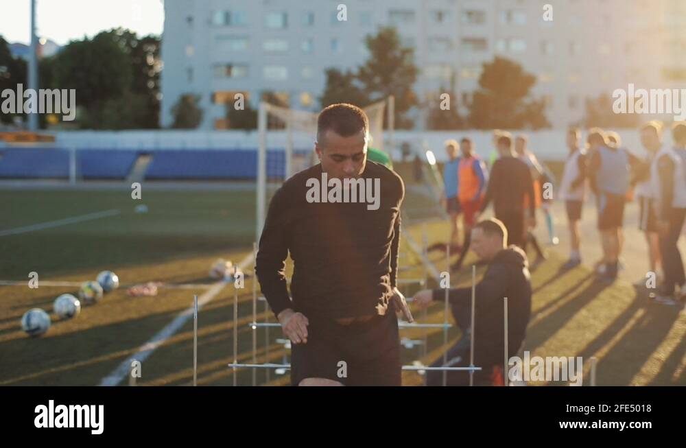 Football. Training. A close-up player of a football team who does an ...