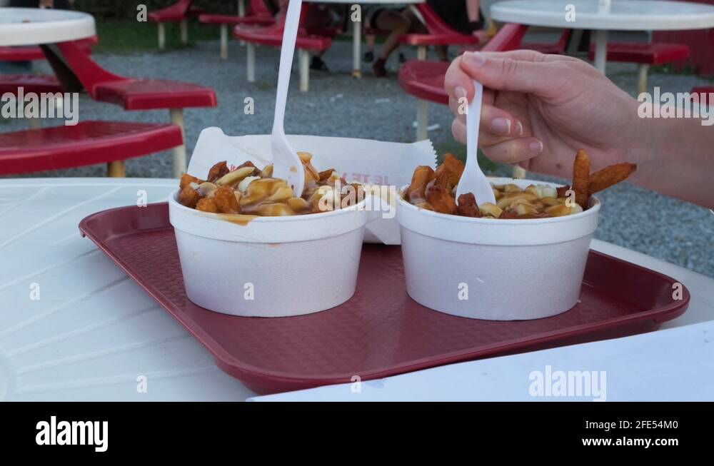 French fries cheese curds brown gravy poutine Stock Videos & Footage ...