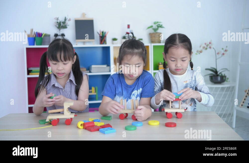 Educational concepts. Kindergarten children compete in the classroom ...