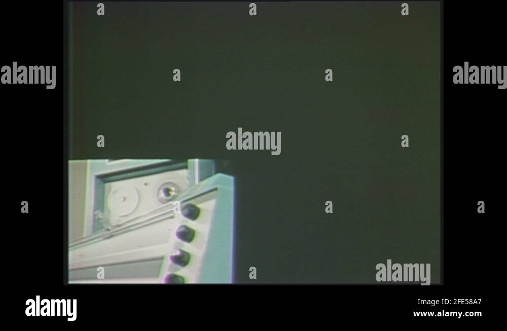 1970s: Split screen images of printer moving, tape reel, text on ...