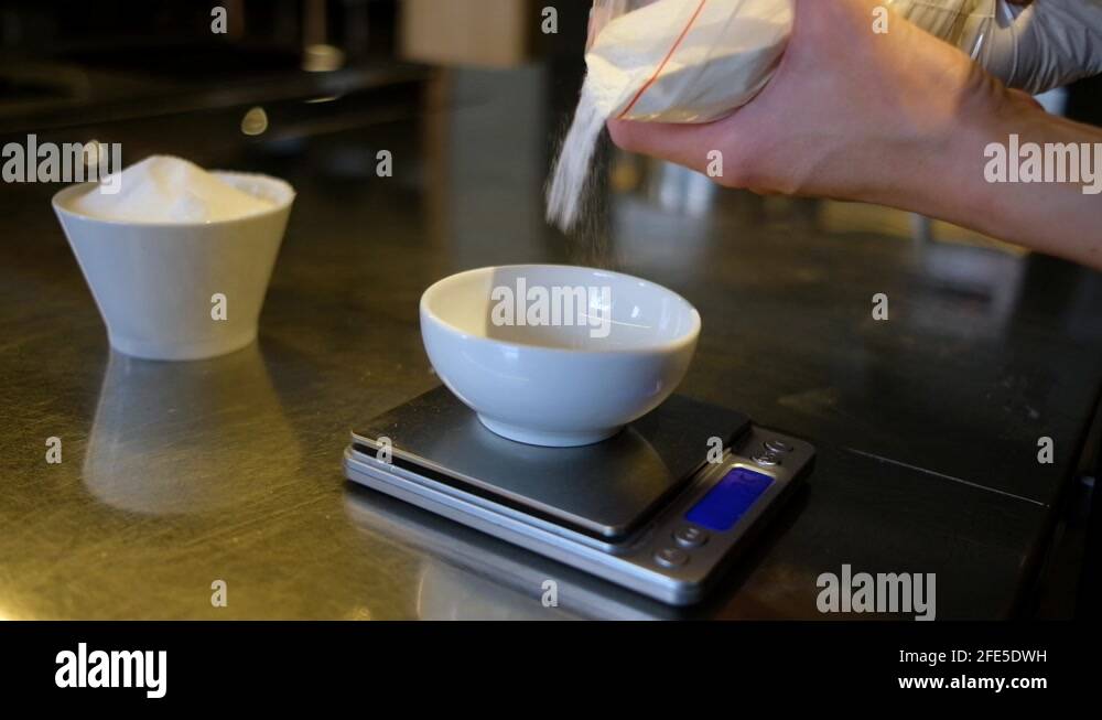 Balance scale flour Stock Videos & Footage - HD and 4K Video Clips - Alamy