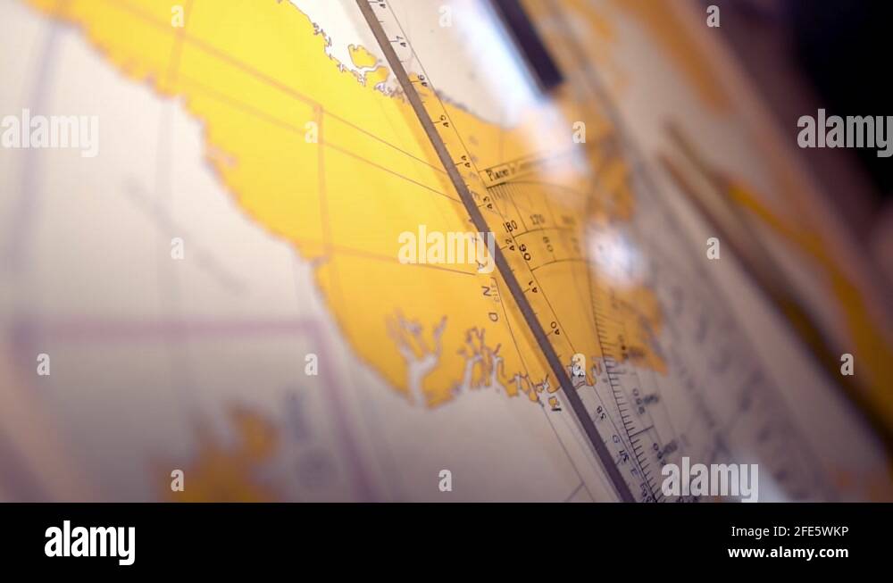 Plotting position on navigational chart at sea. Marine Map and ruler ...