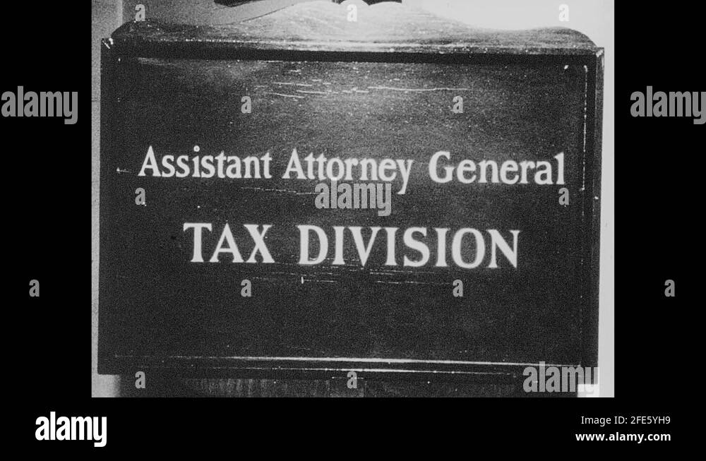 1960s: Sign on wall. Women work at desks in large office. Robert ...