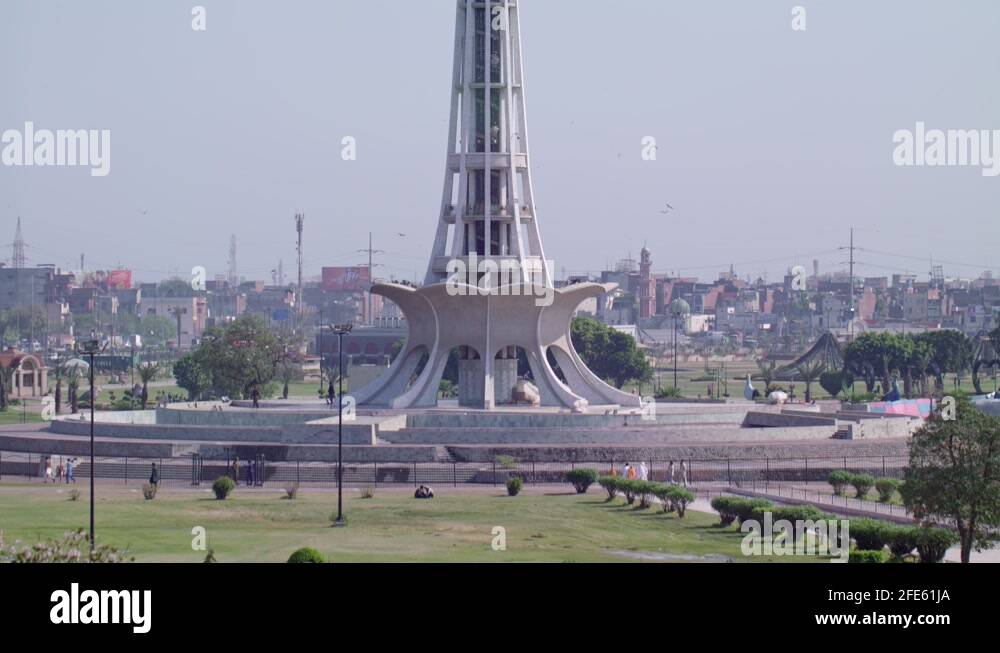 Camera lens tilts up to reveal Minar-e-Pakistan, a famous landmark in ...
