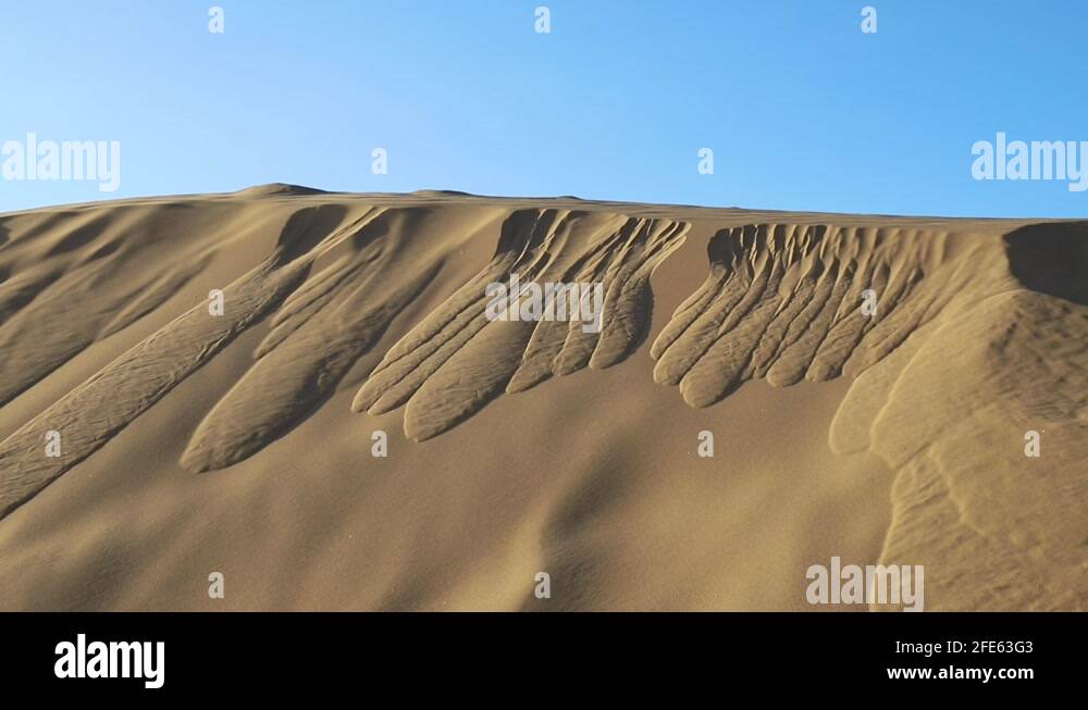 sand storms in desert in windy day in XiangshaWan, or Singing sand Bay ...