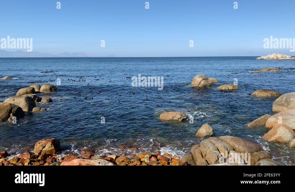 Rocky shoreline and nutrient rich deep blue ocean rich marine life of ...