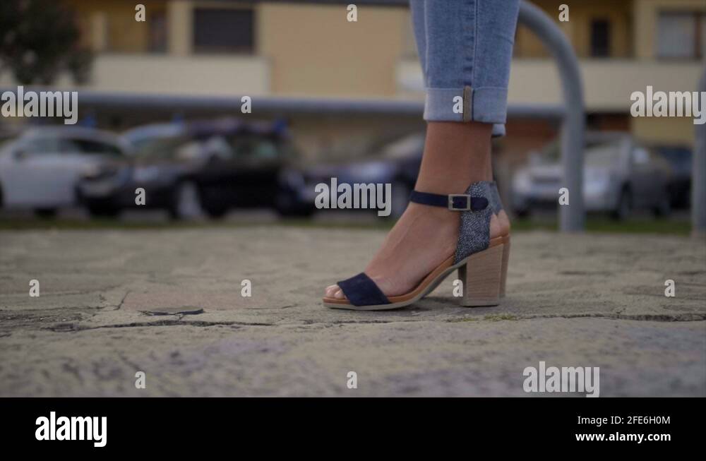 Italian Model feet walking at the seafront Lago di Grade, Trobole, with ...