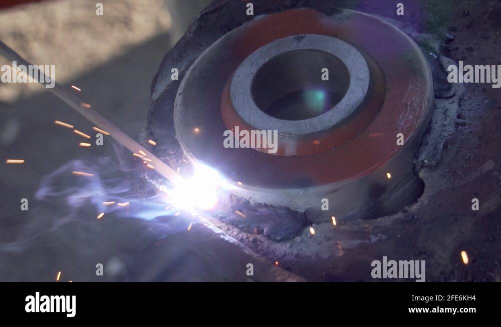 Welding with Electrode a Circle Piece of Metal - Close Shot Slowmo ...