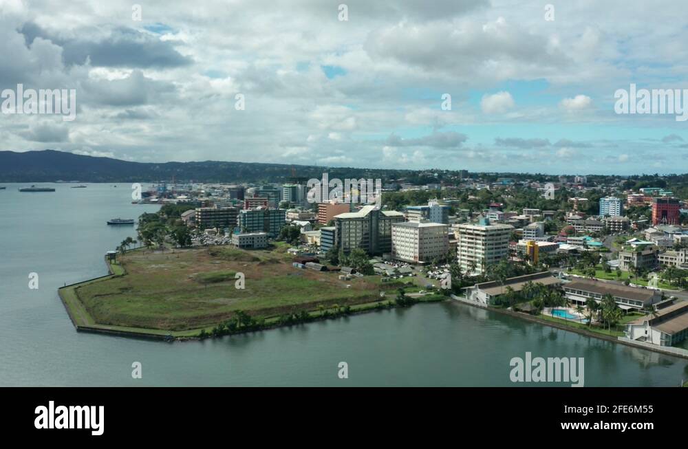 Hotels and resorts on coast of capital Suva in Fiji, aerial shot, pan ...
