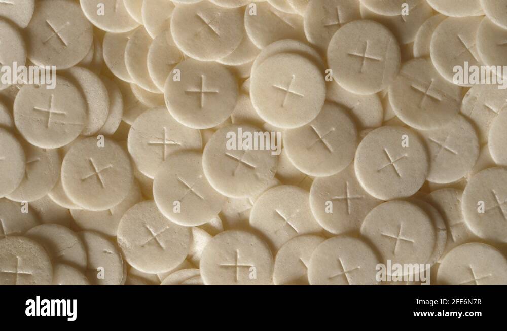 communion hosts sacramental breads turning round rotating flat lay top ...