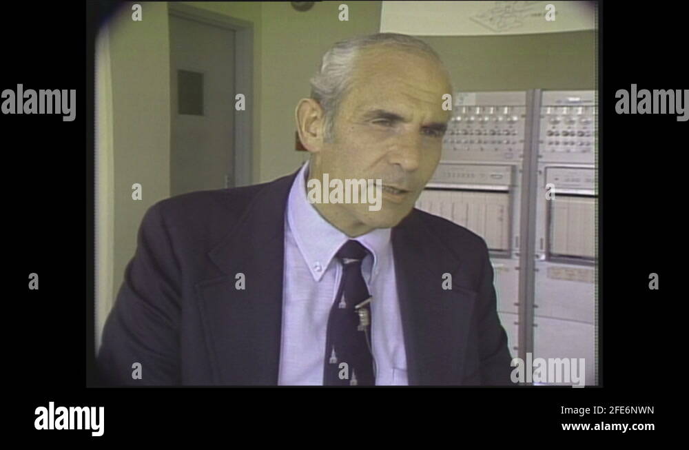 1980s: Control room. Men speak. Caption reads "Ronald Thomas, Manager ...