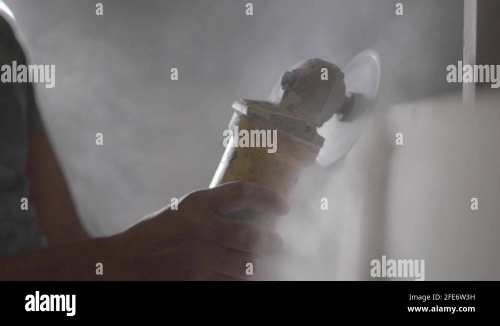 Dust And Fine Particles Flying In The Surface While A Worker Polishing ...