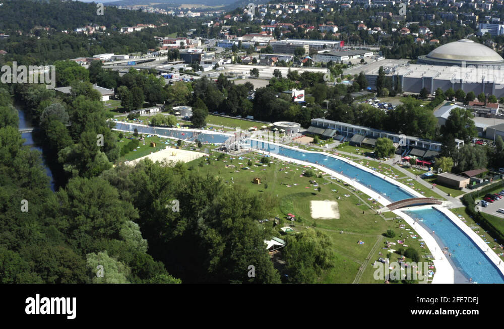 Crowds Of People At Public Swimming Pool During Summer, Brno Skyline ...