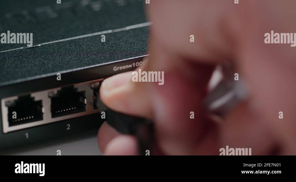 Plug in and out on internet switch Stock Video Footage - Alamy