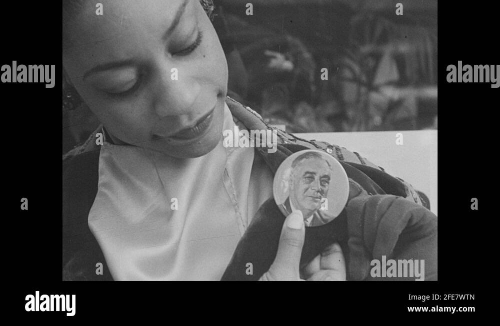 1940s: Woman holds Roosevelt button on lapel. Kids hold up signs ...