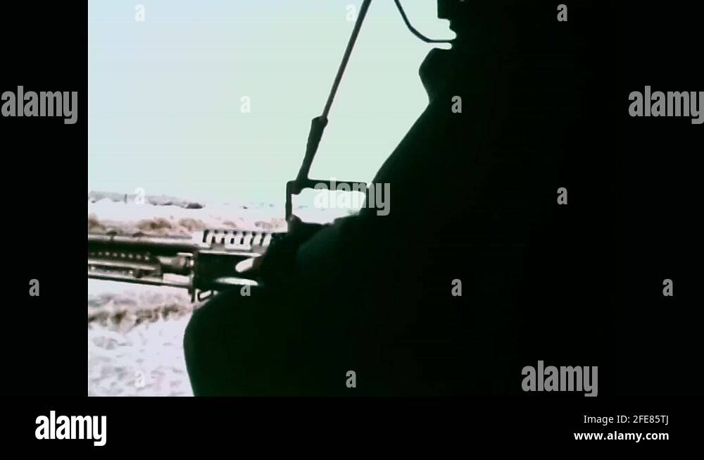 1967 Vietnam - A door gunner of a Huey firing weapon Stock Video ...