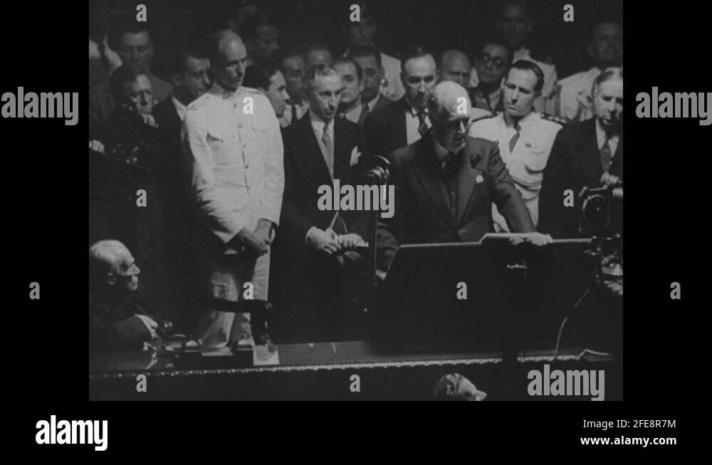 1930s: man delivering speech to crowd then introducing and shaking ...