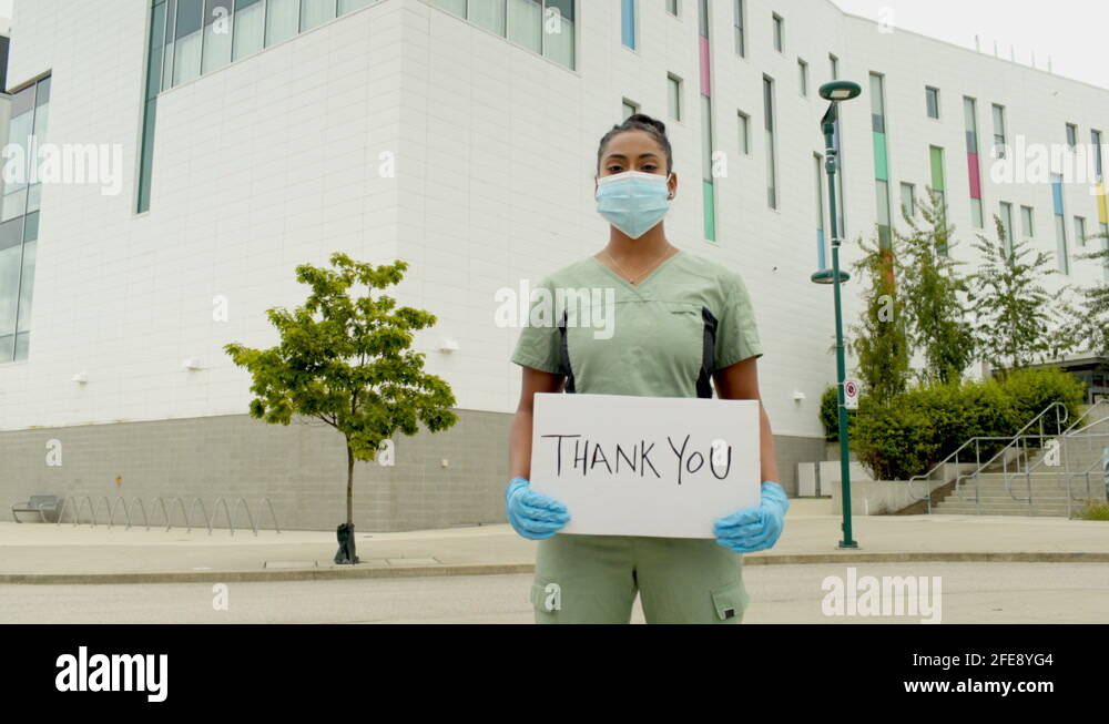 Indian ethnicity woman, POC, nurse doctor wearing PPE uniform, gloves ...