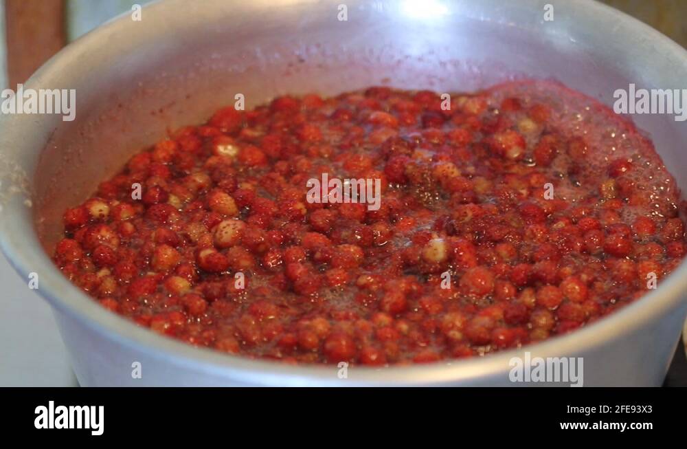Making a homemade strawberry jam. Boiling fruit into a pan Stock Video ...