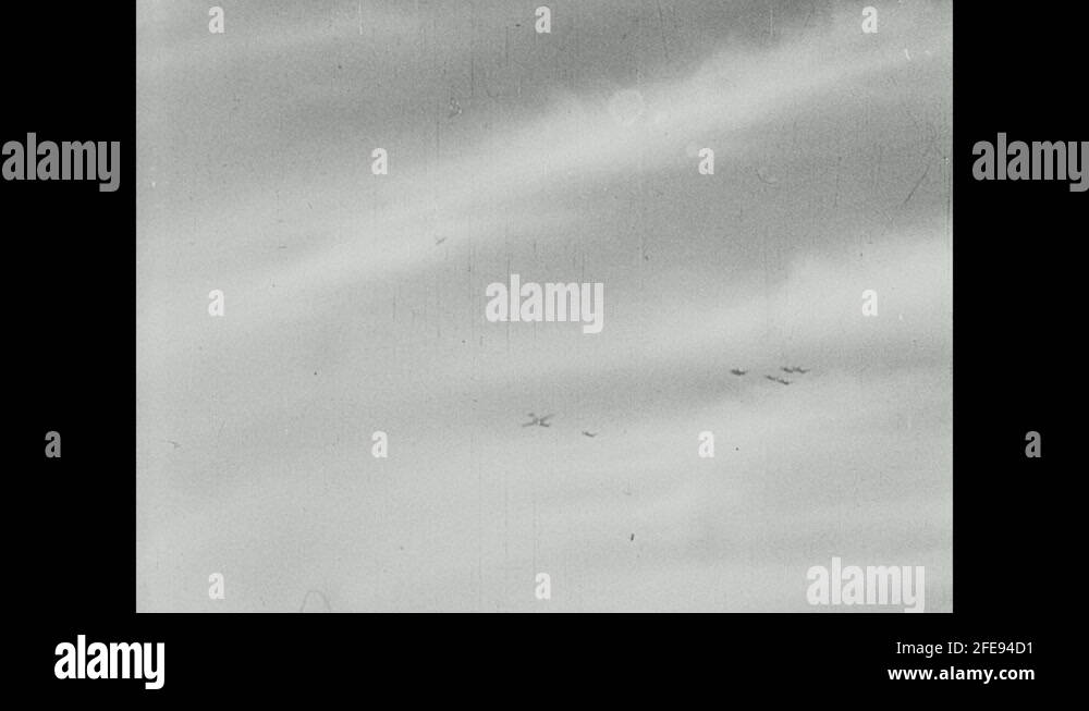 1940s: Long shot of planes. Shots of soldiers firing guns in planes ...