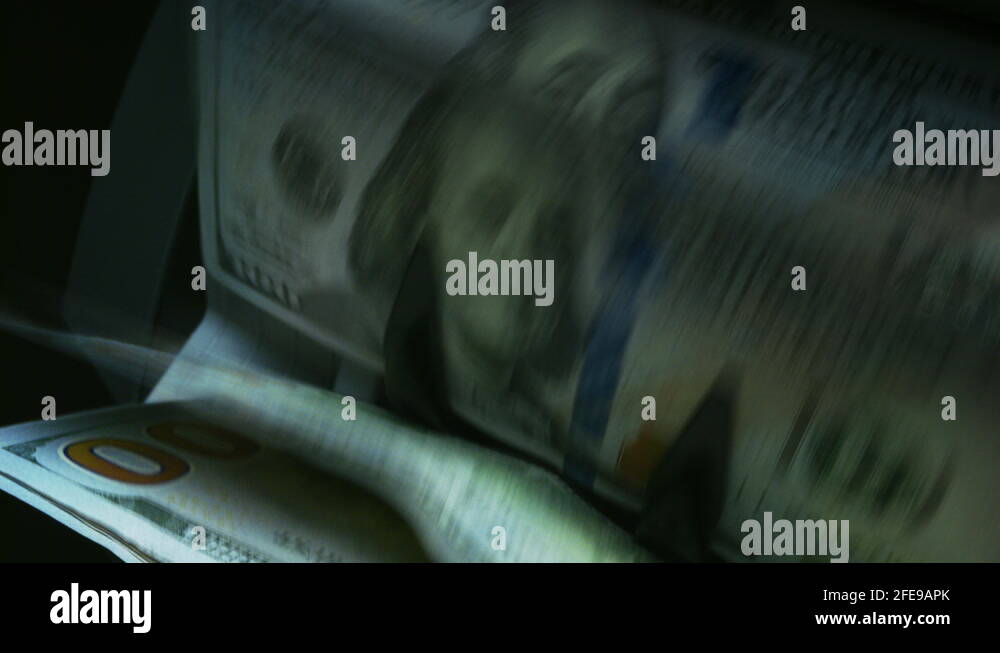 Money counting machine. Electronic counter counting 100 dollar bills ...