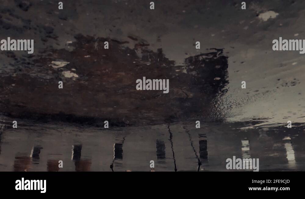 Rain puddle reflection in Stock Videos & Footage - HD and 4K Video ...
