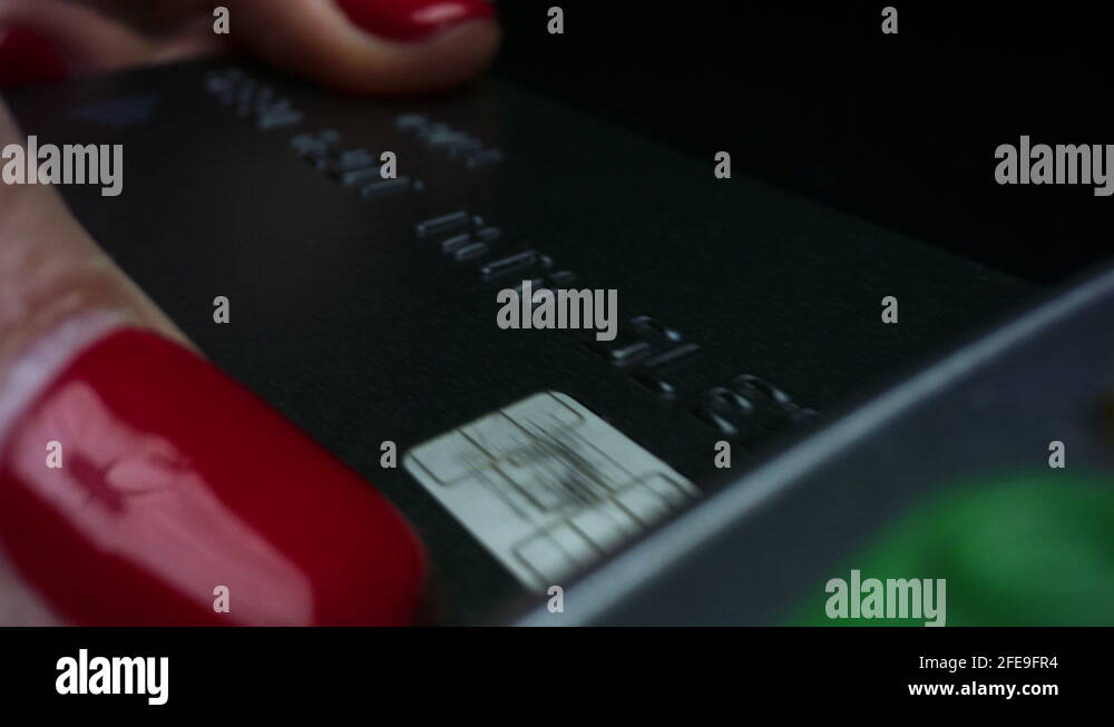 Woman inserting credit card in pos terminal.Female entering pin code on ...