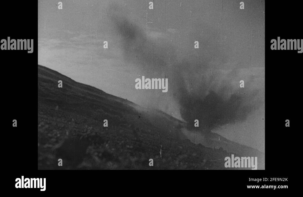 1940s: Cannon fires. Explosion. Soldiers standing behind cannon. Large ...