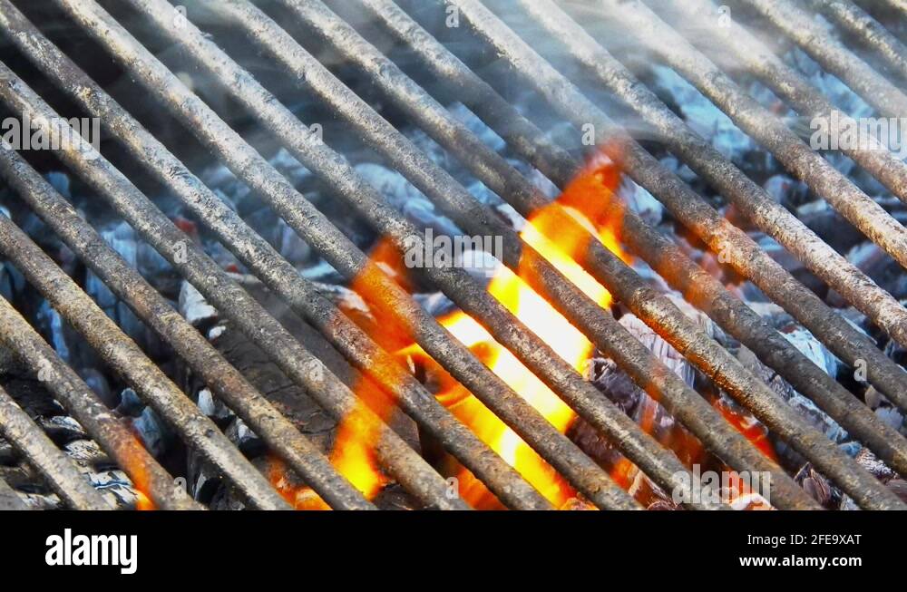 Barbeque fire, logs burning and bbq heating up Stock Video Footage - Alamy
