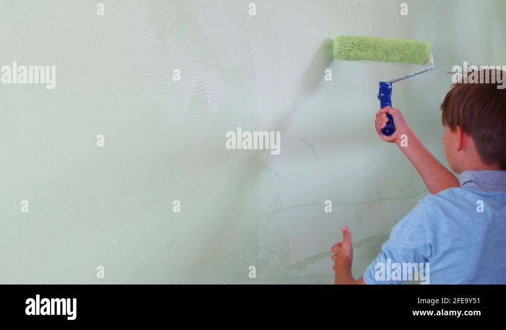 Boy paints wall Stock Videos & Footage - HD and 4K Video Clips - Alamy