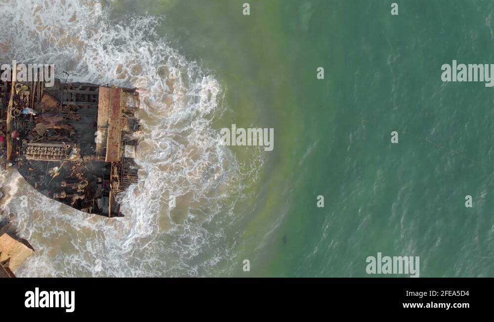 Parts of the dredger ship at the coast of beach during dismantling the ...