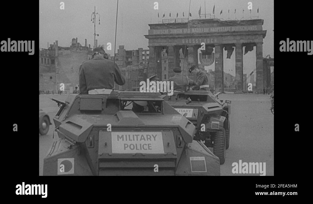 1950s Europe: Military police vehicles drive through Berlin. Soviet ...