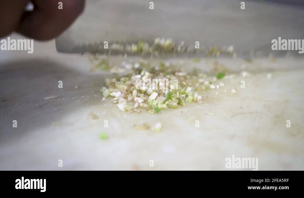 Chopping Spring Onion Into Small Pieces Using Big Kitchen Knife And Put ...
