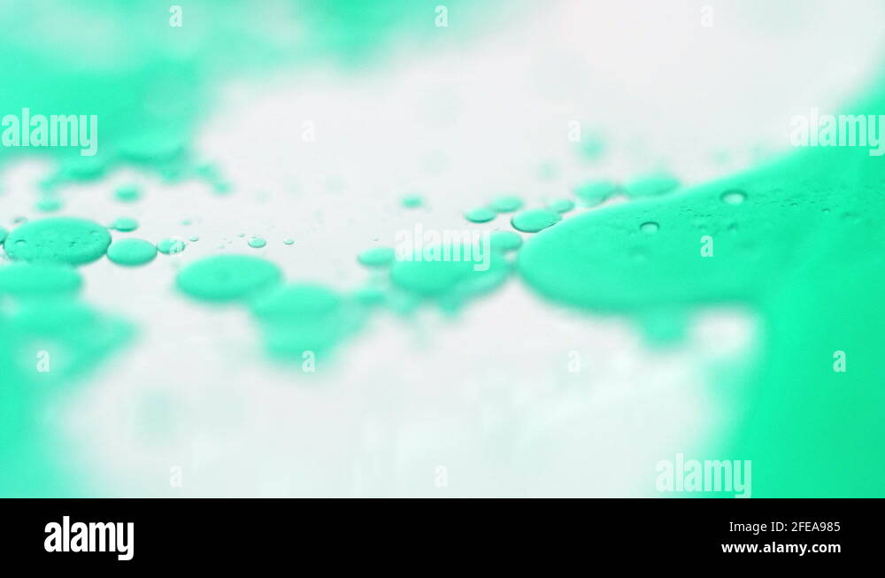 Mixture Of Clear And Green Gel With Bubbles Blown From A White Surface ...