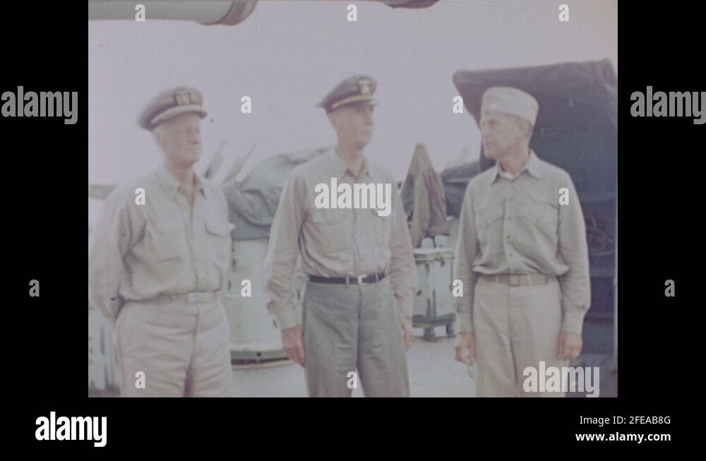 1940s: Officers stand and pose on deck of ship. Officers stand on deck ...