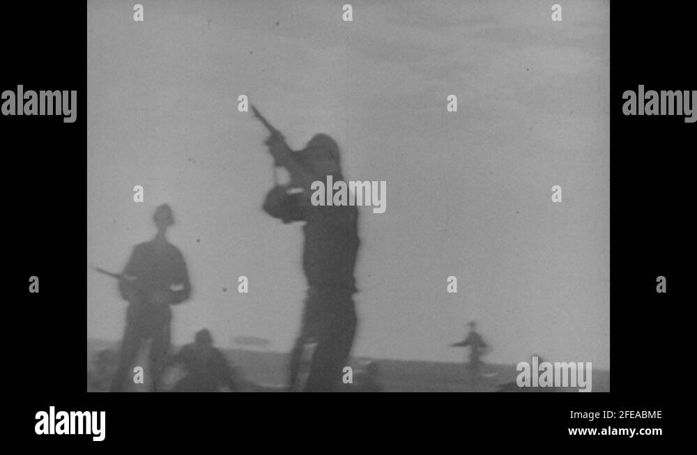 1940s: Planes and tanks attack men in field. Soldiers fight across open ...