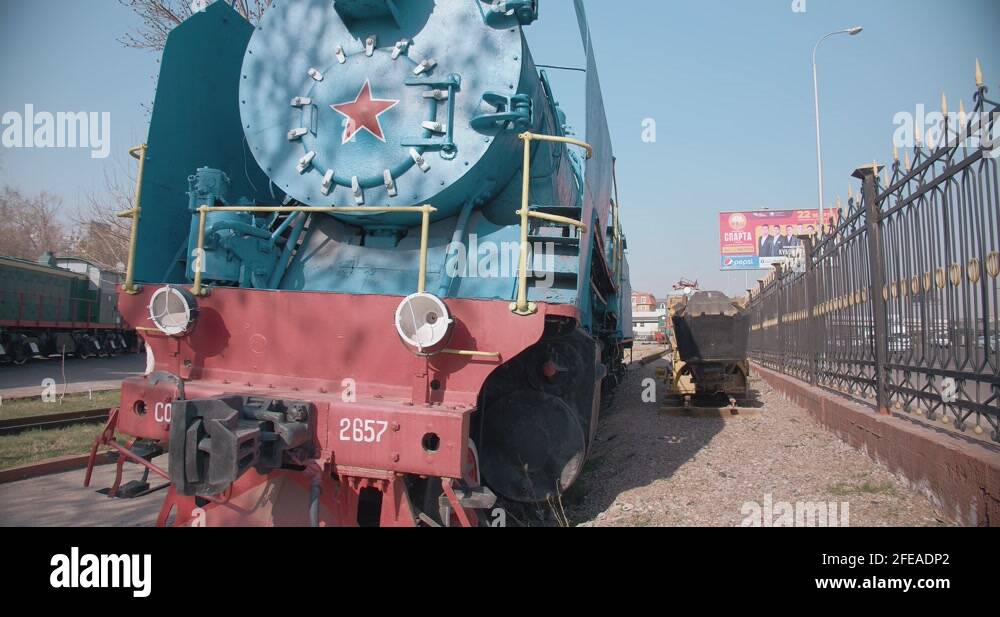 Blue color old steam train with a red star. The steam locomotive made ...