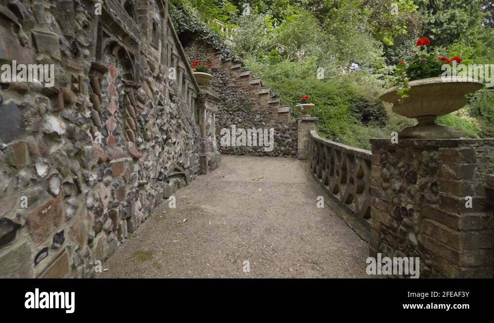 Beautiful bucolic pathway with a view of a Medieval terrace wall in a ...