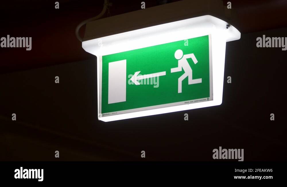 Close up view of an emergency exit sign in a dark room Stock Video ...
