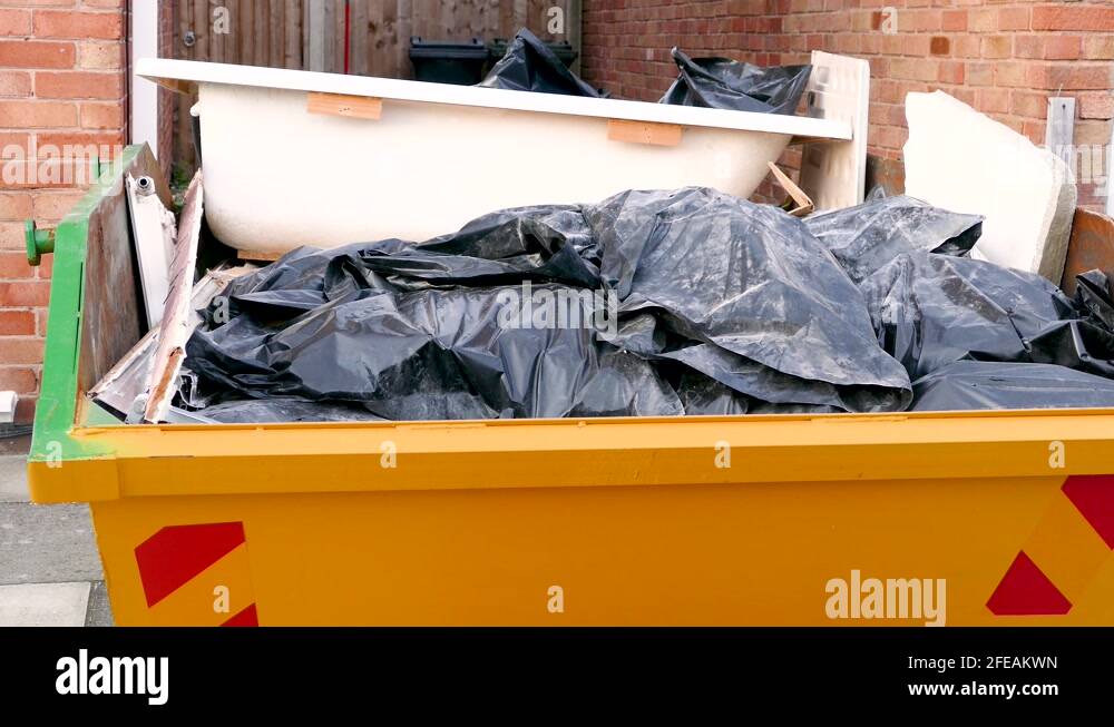 Builders skip waste Stock Videos & Footage - HD and 4K Video Clips - Alamy