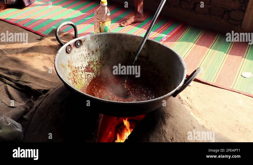 Overhead of meat cooking in wok over open flame outdoors Stock Video ...
