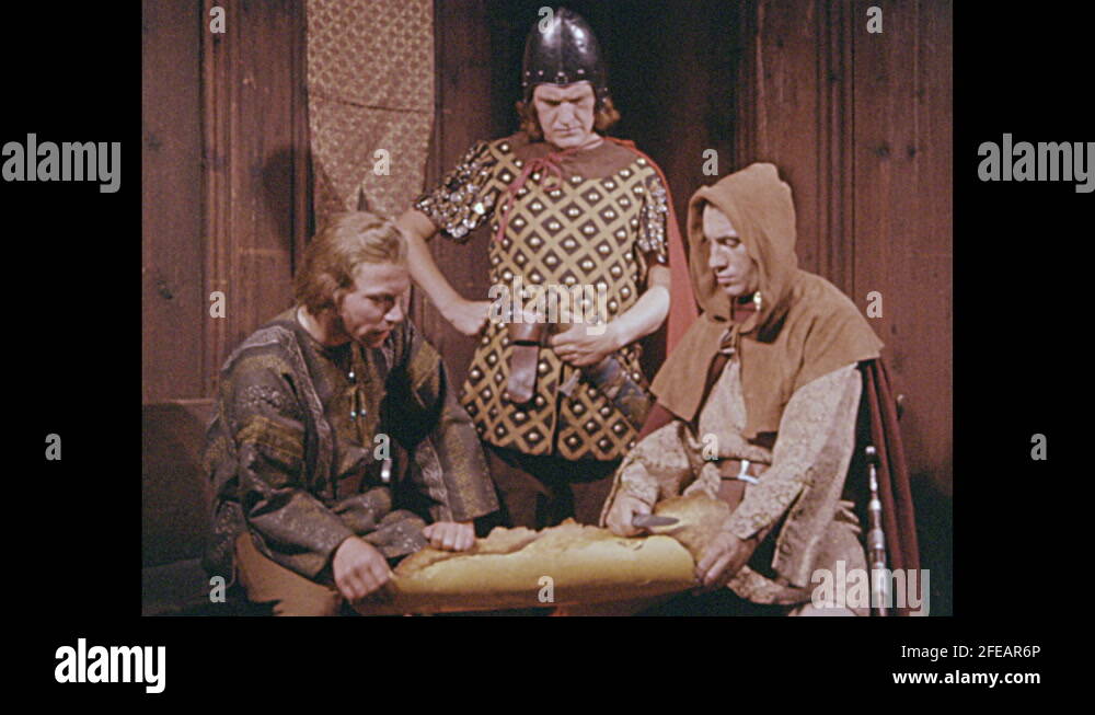 1950s: Men in period costume talking, looking at map, men pull out ...