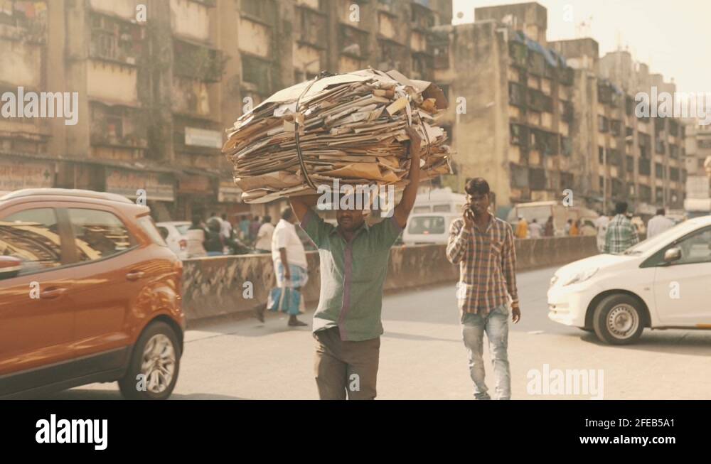 Man in street of Mumbai slums, India Stock Video Footage - Alamy