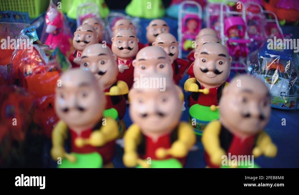 Cartoon figure Toys at show in a shop at a fair in a festival in India ...