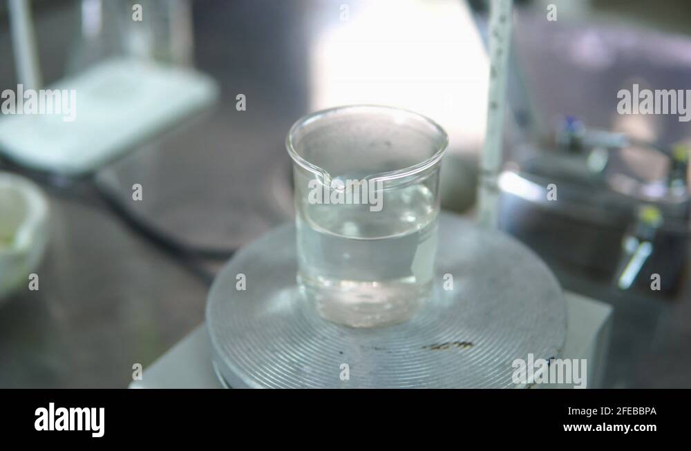 beaker carrying out a chemical reaction Stock Video Footage - Alamy