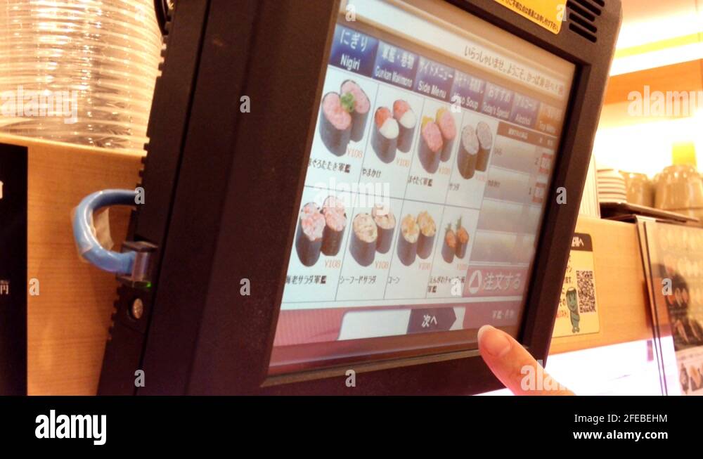 Ordering Sushi at a Conveyor Belt Sushi Restaurant. Hiroshima Japan ...
