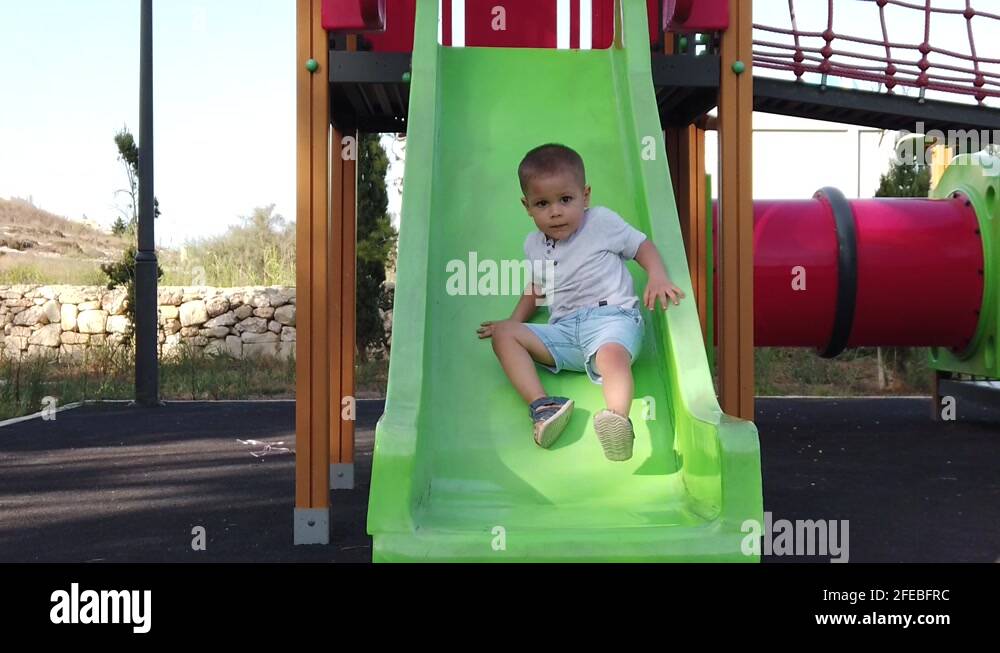 Boy sliding on slide Stock Videos & Footage - HD and 4K Video Clips - Alamy