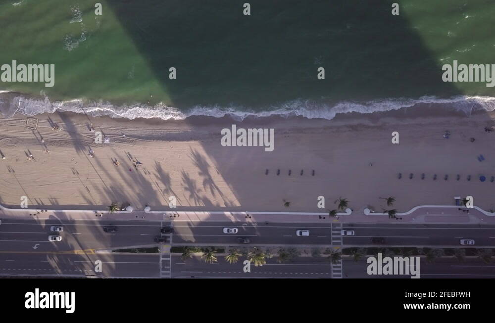 Cinematic 4k smooth sliding motion to right of ocean waves on a beach ...