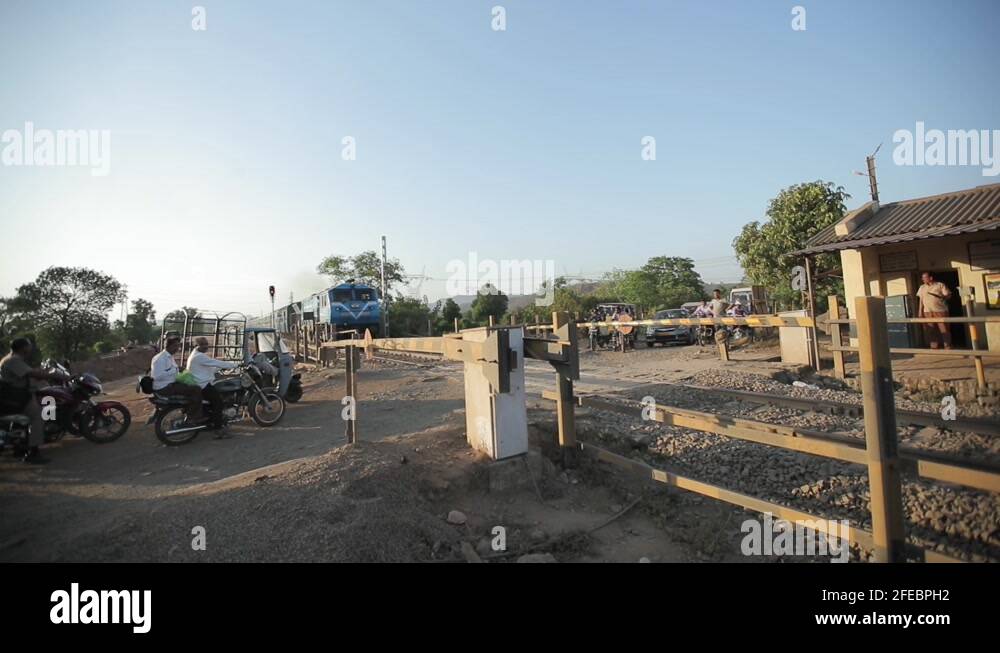 Train crossing road india Stock Videos & Footage - HD and 4K Video ...