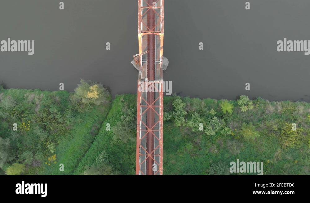 Old rusty abandoned railroad bridge directly from above - aerial view ...